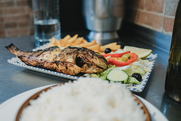 Whole Fresh grilled fish with fries